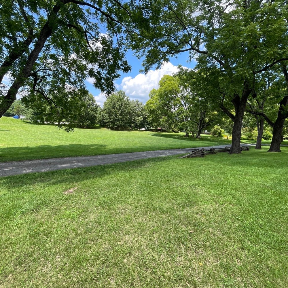 2024_06_paved walking path thru trees - Lynchburg Parks & Recreation